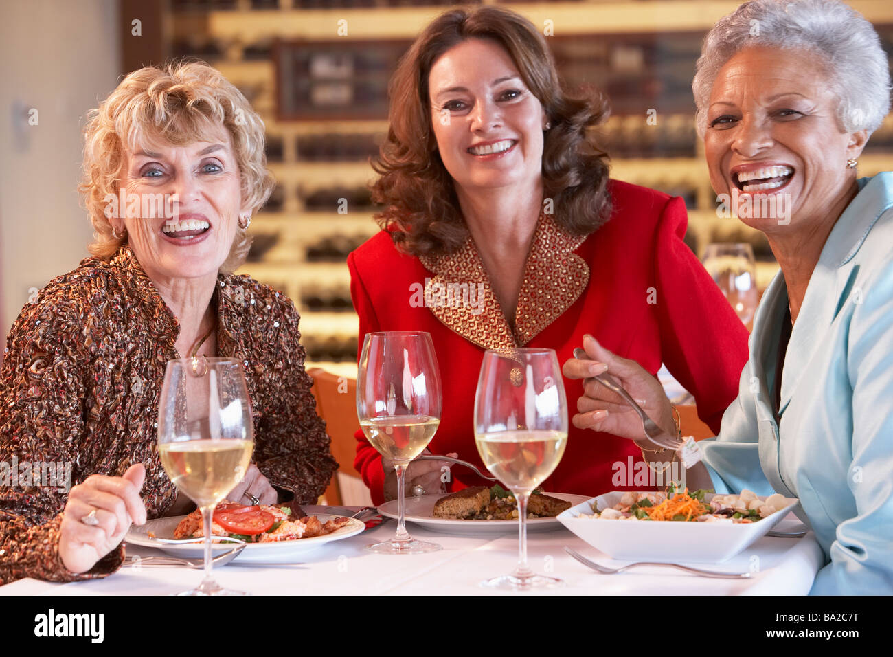 Three women having a meal at restaurant hi-res stock photography and ...