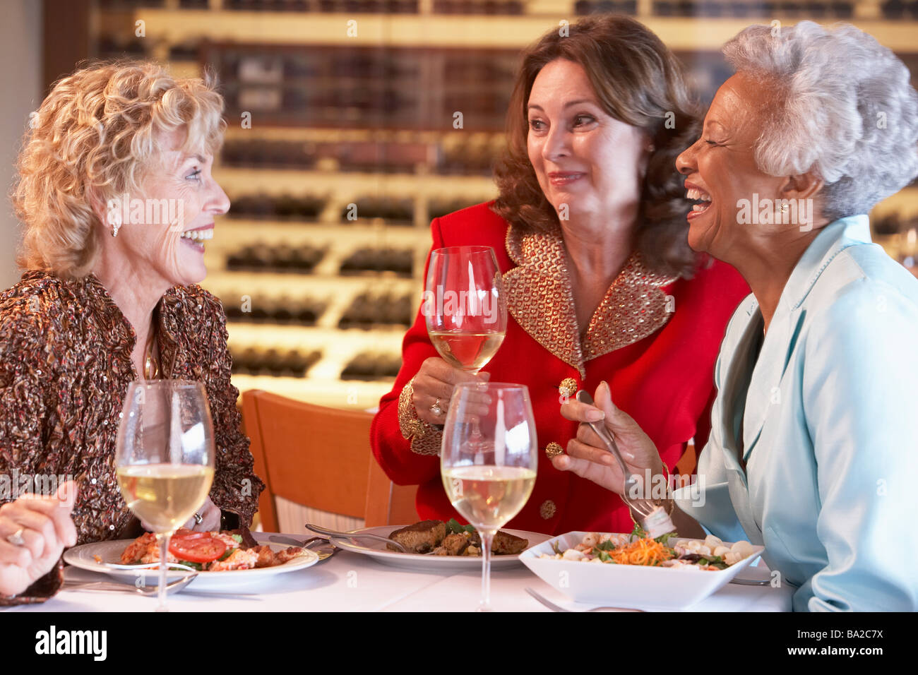 Friends Having Dinner Together At A Restaurant Stock Photo - Alamy