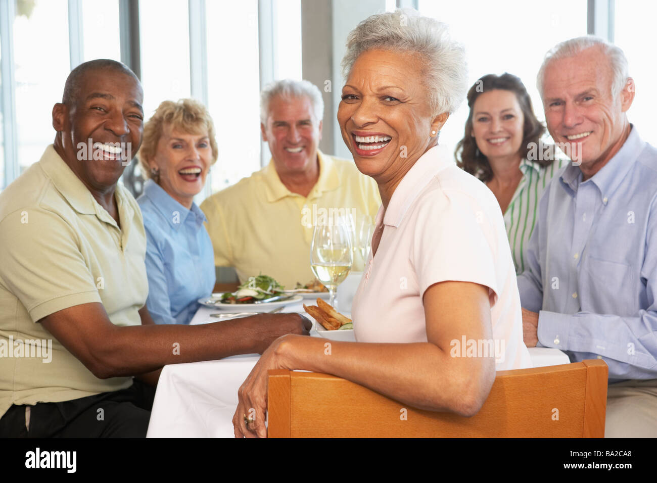Friends Having Lunch Together At A Restaurant Stock Photo - Alamy
