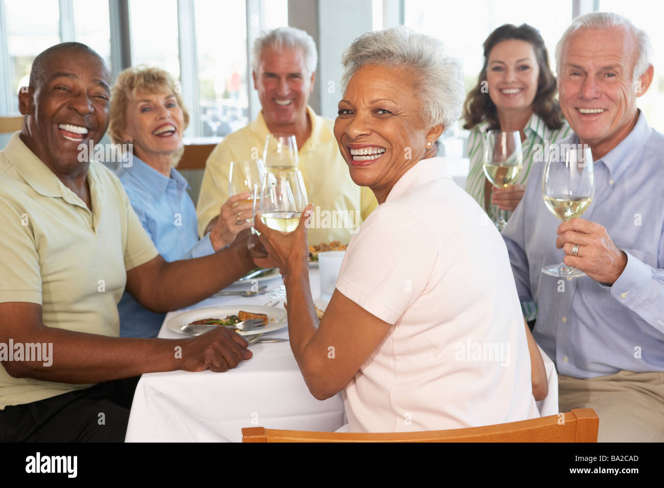 Friends Having Lunch Together At A Restaurant Stock Photo - Alamy