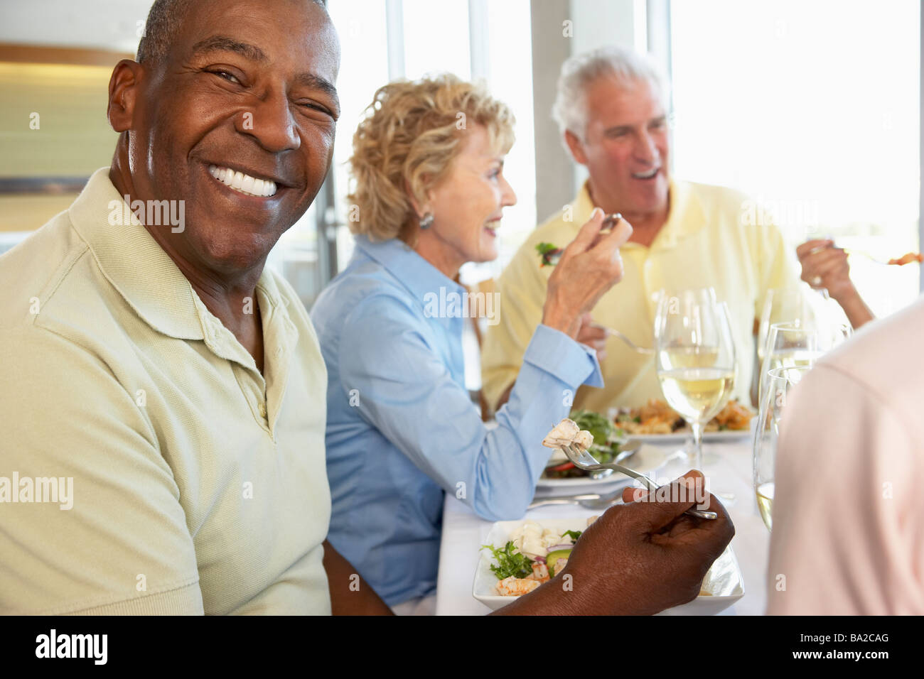 Friends Having Lunch Together At A Restaurant Stock Photo - Alamy