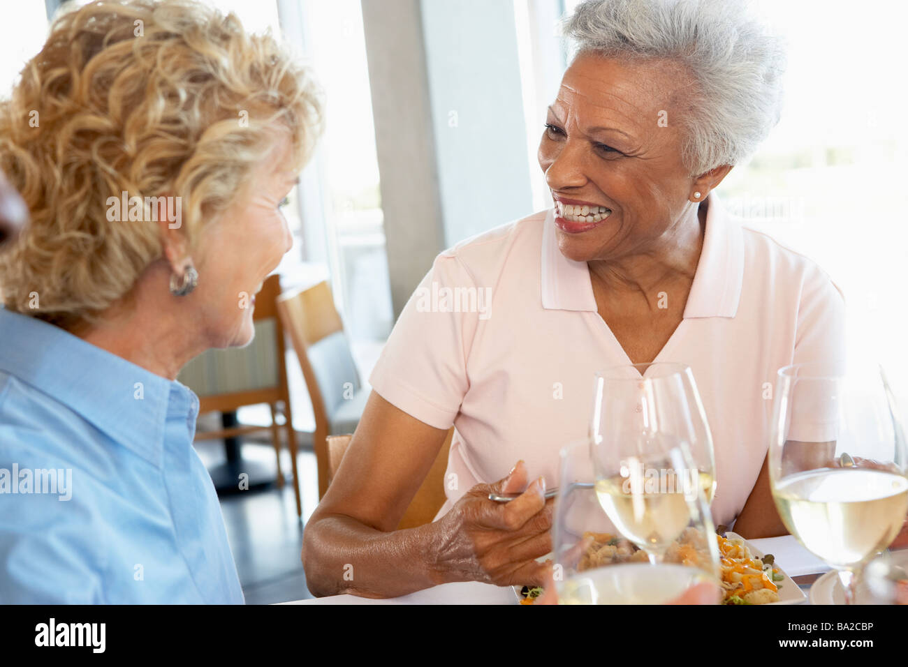 Friends Having Lunch Together At A Restaurant Stock Photo - Alamy