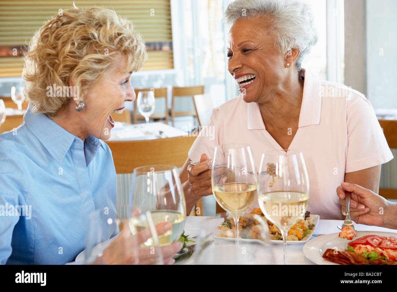 Friends Having Lunch Together At A Restaurant Stock Photo - Alamy