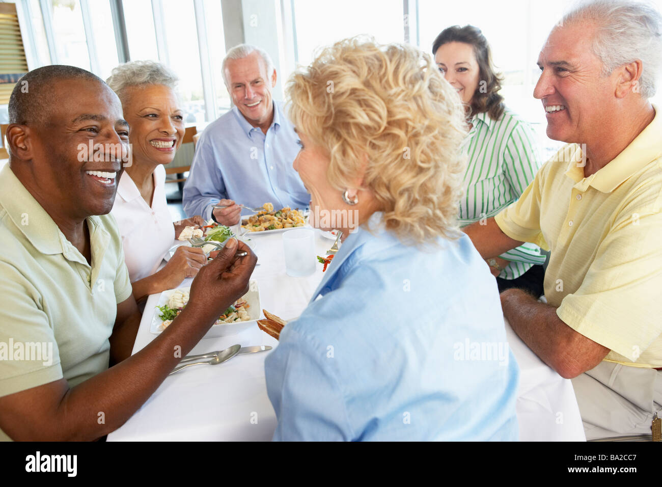 Friends Having Lunch Together At A Restaurant Stock Photo - Alamy