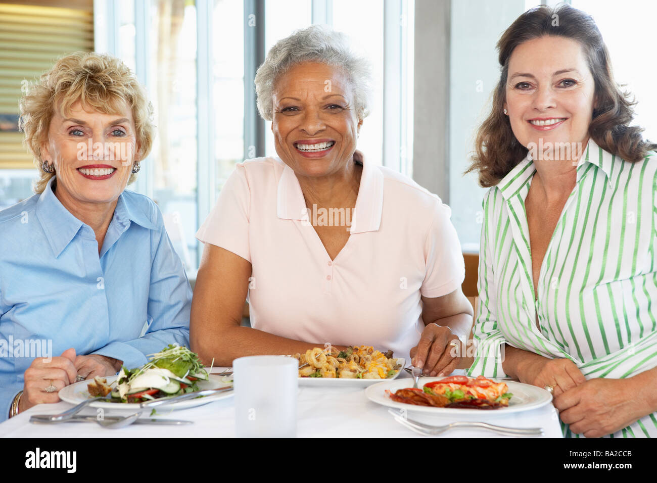 Friends Having Lunch Together At A Restaurant Stock Photo - Alamy