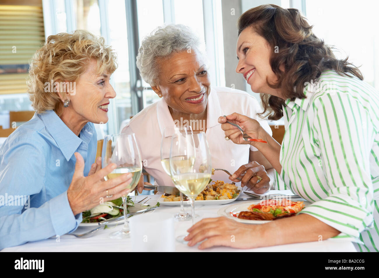 Friends Having Lunch Together At A Restaurant Stock Photo - Alamy