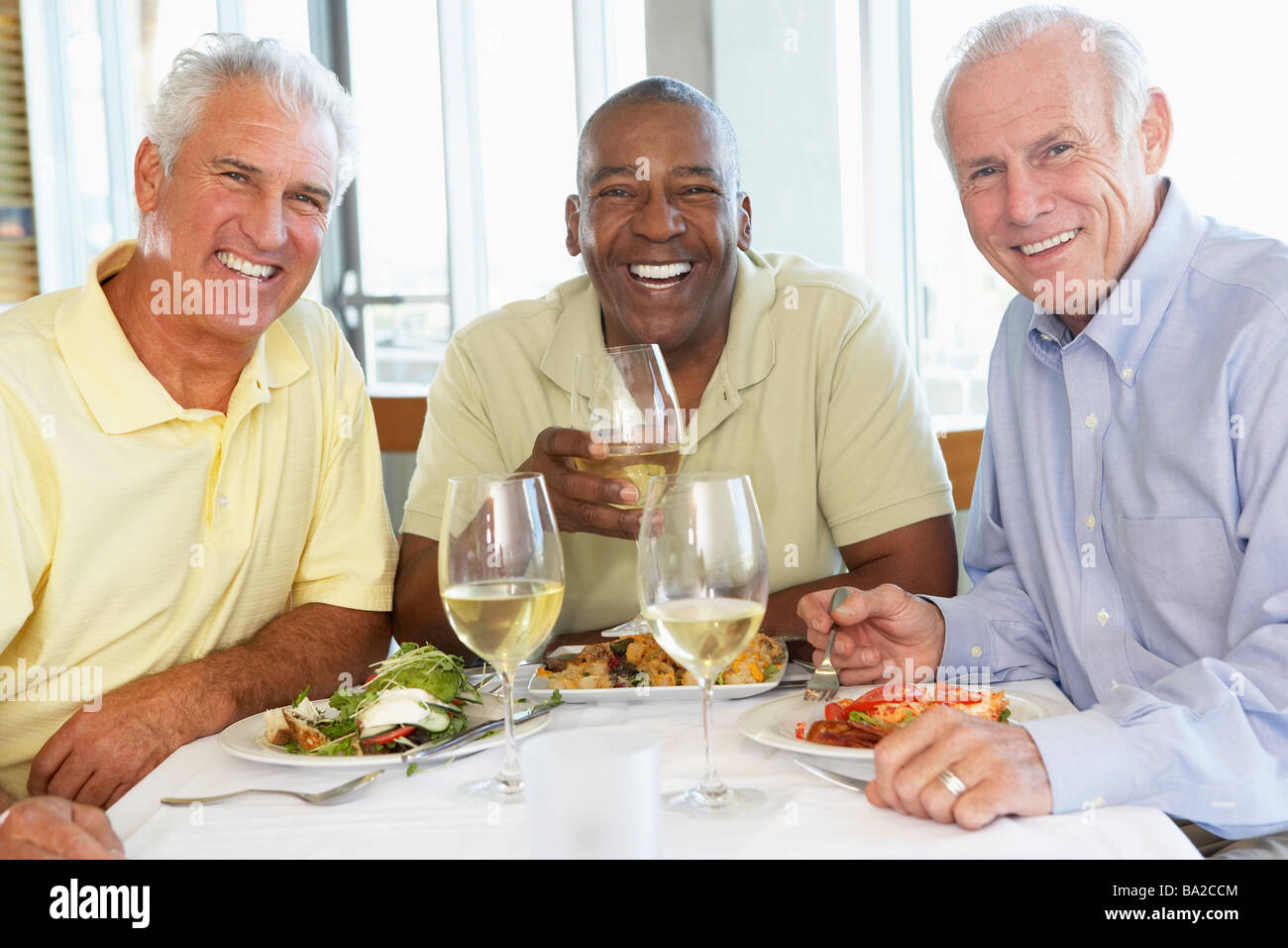 Friends Having Lunch Together At A Restaurant Stock Photo - Alamy