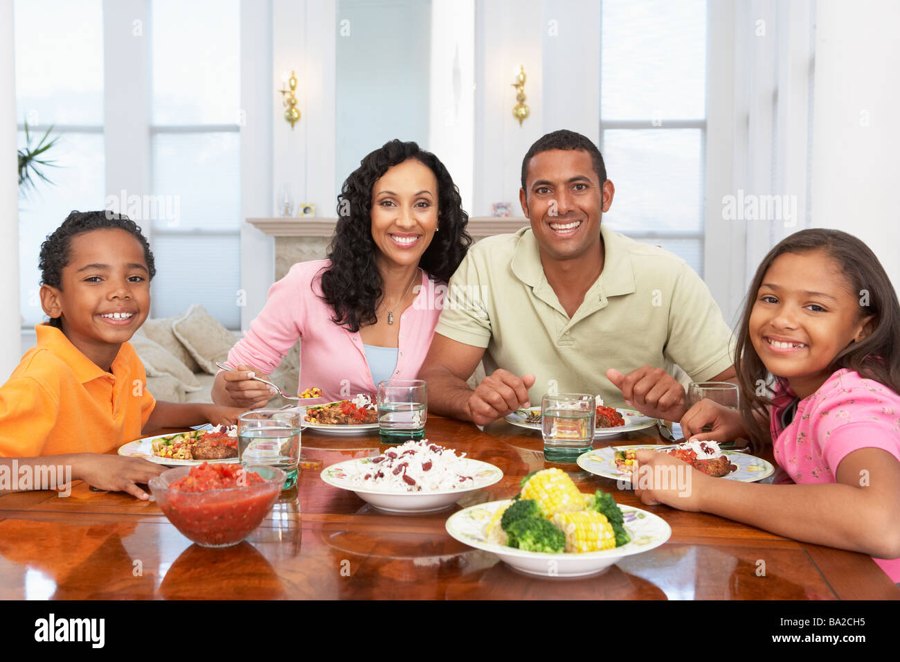 Family Having A Meal Together At Home Stock Photo - Alamy