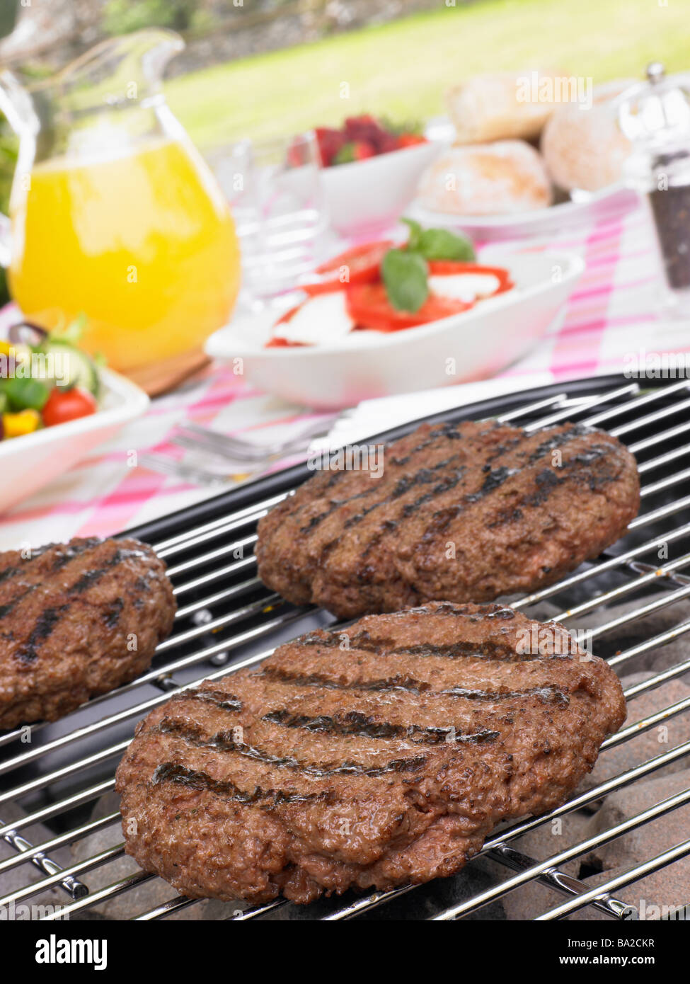 Burgers Cooking On Barbeque Grill Stock Photo - Alamy