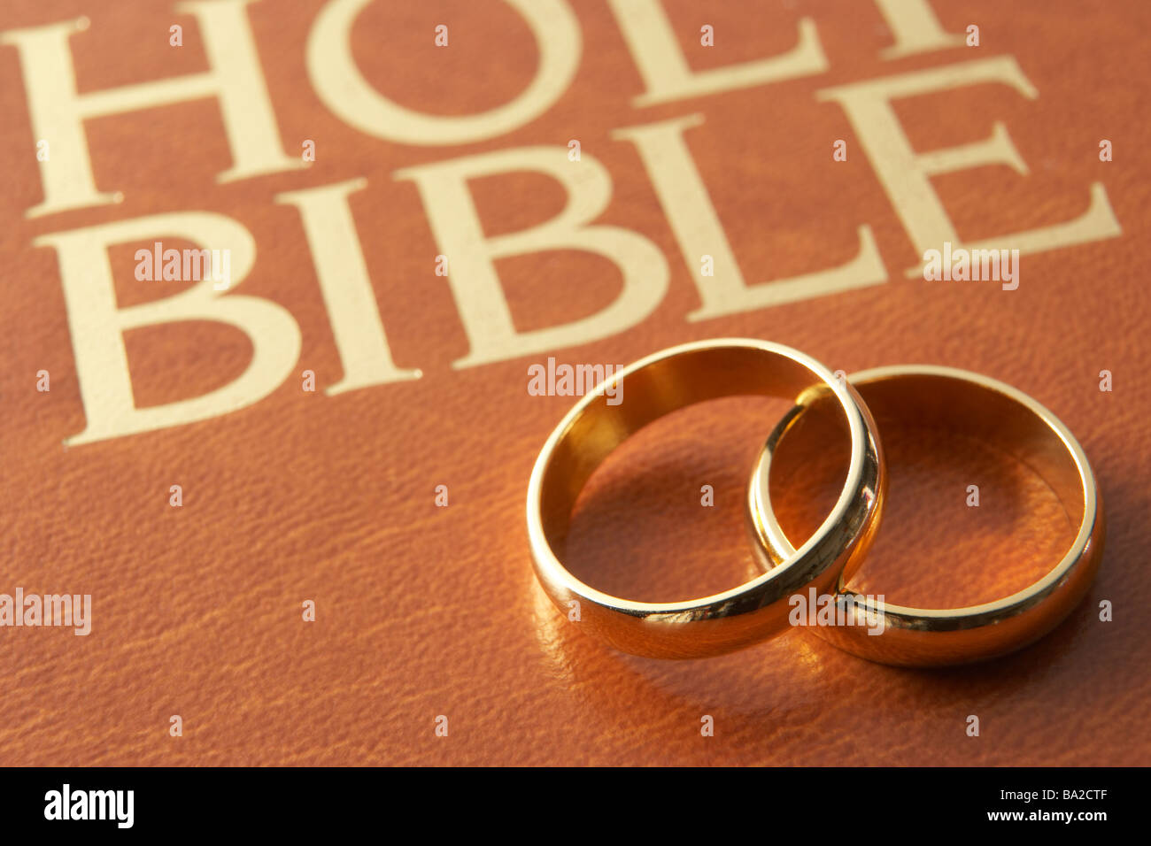Wedding Rings Resting On A Holy Bible Stock Photo - Alamy