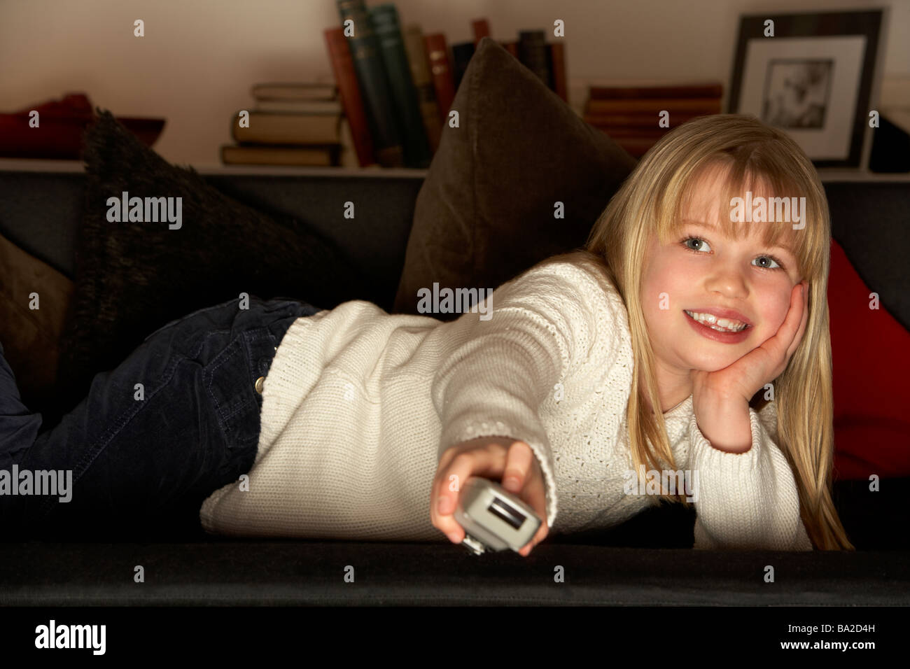 Young Girl Using Television Remote Control Stock Photo - Alamy