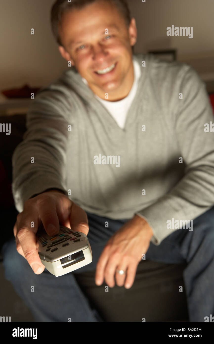 Man using tv remote hi-res stock photography and images - Alamy