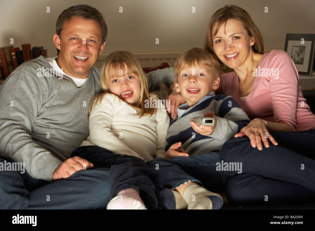 Family Watching Television Together Stock Photo - Alamy