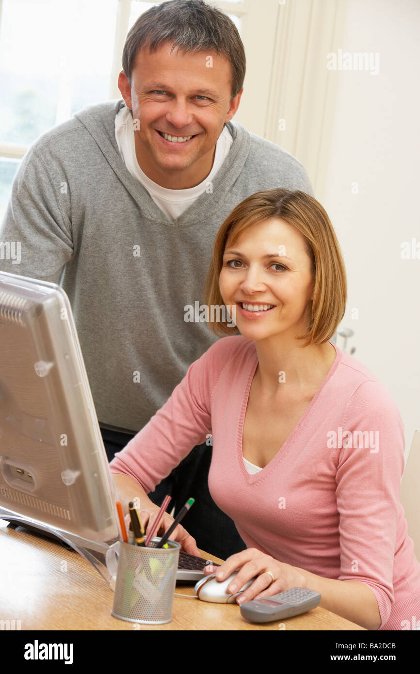 Couple Using Computer Stock Photo - Alamy