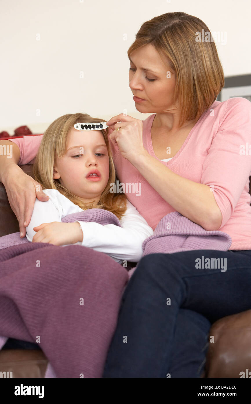 Mother Taking Temperature Of Sick Daughter Stock Photo - Alamy