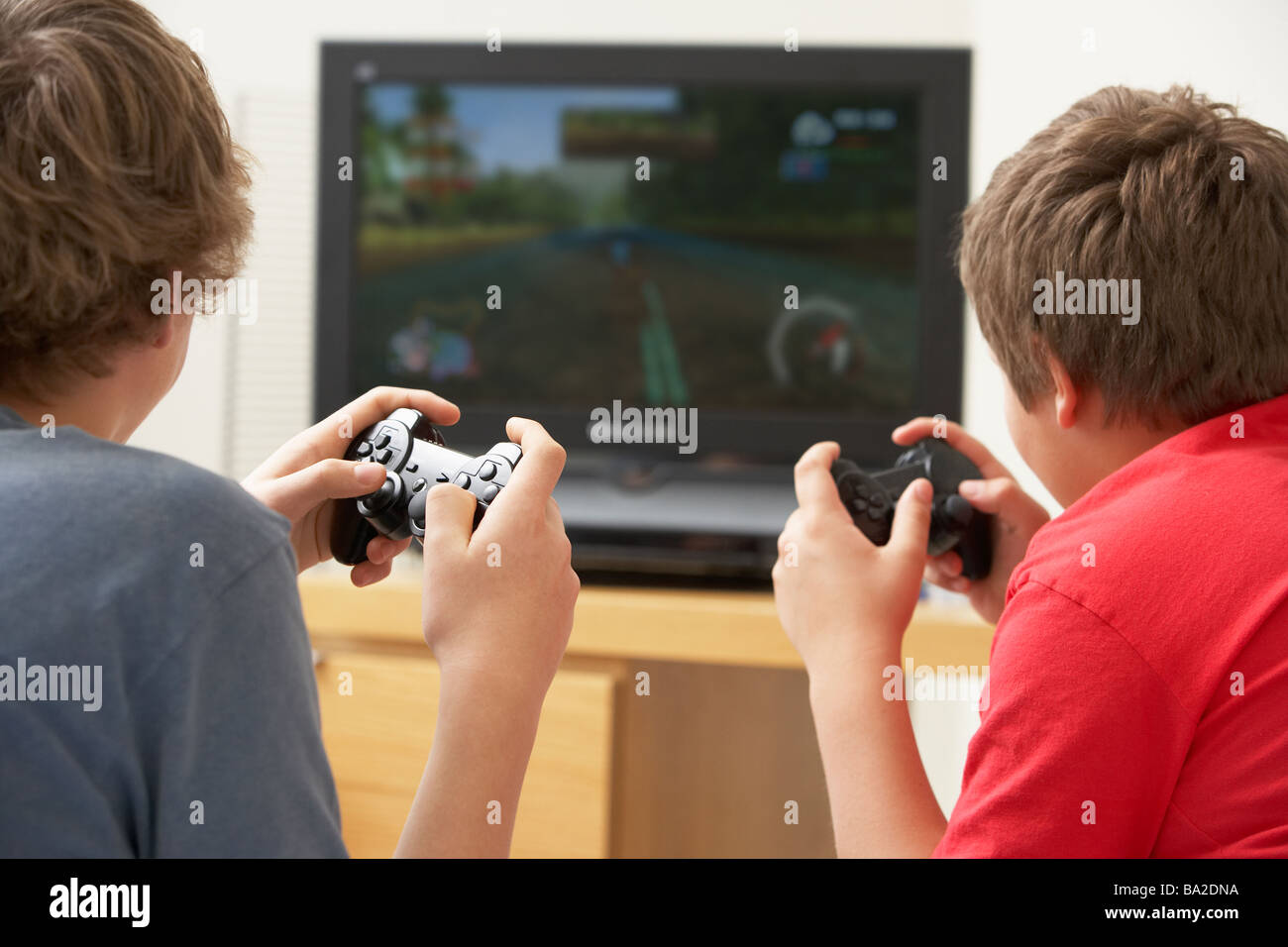 Two Boys Playing With Game Console Stock Photo - Alamy
