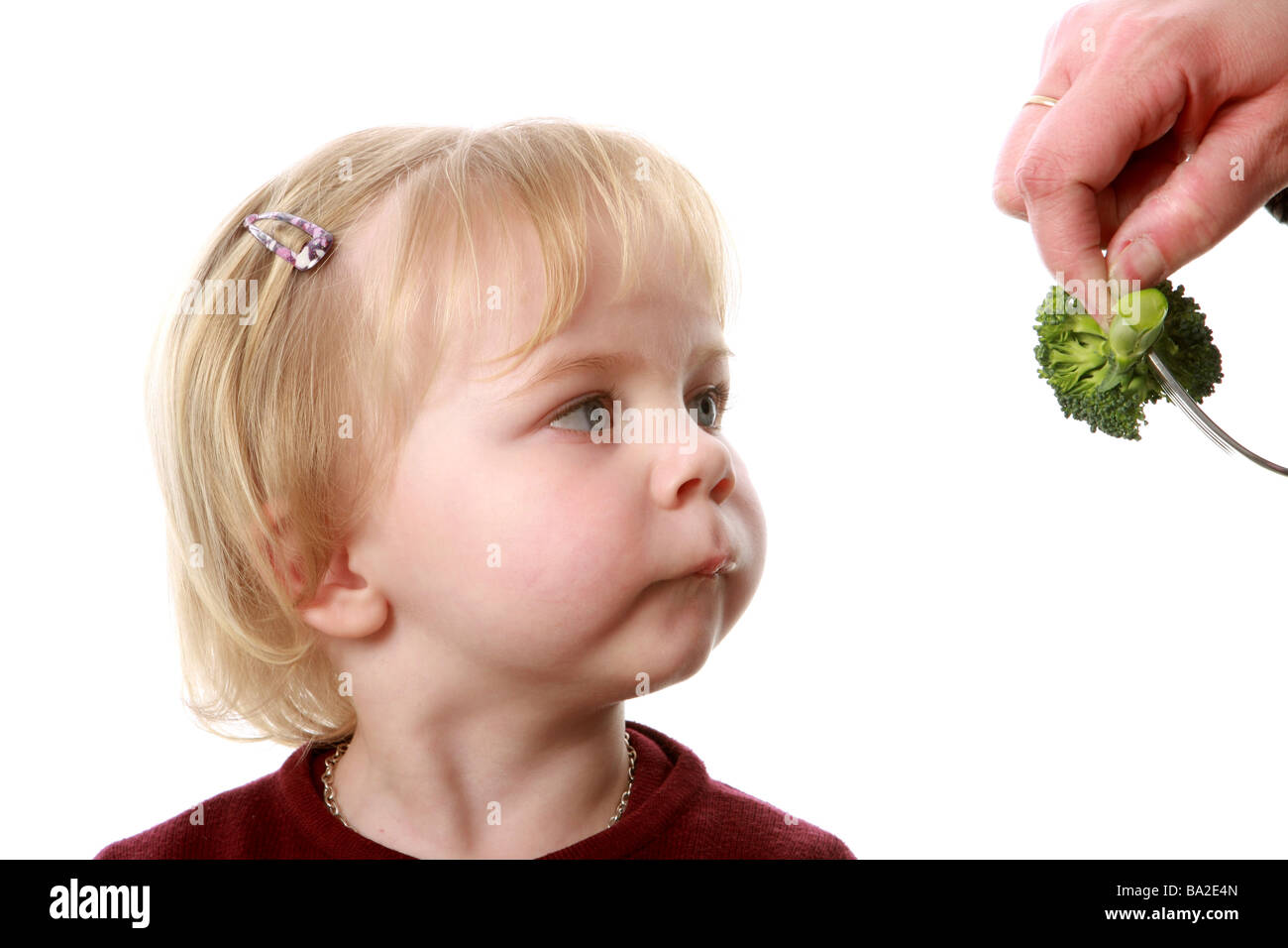 A little girl refuses Broccoli on a fork Stock Photo - Alamy