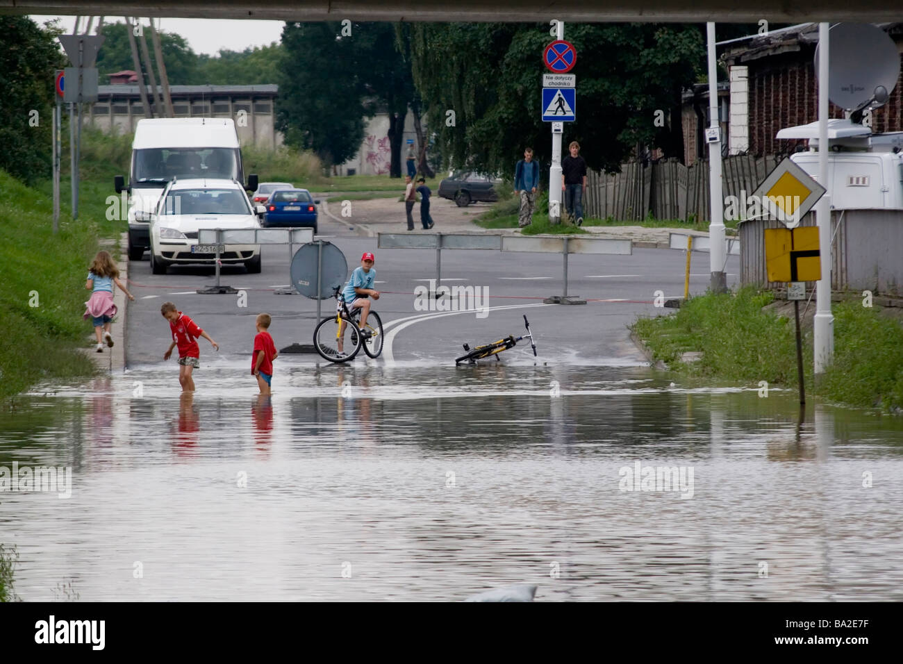 Kids playing in flood hi-res stock photography and images - Alamy