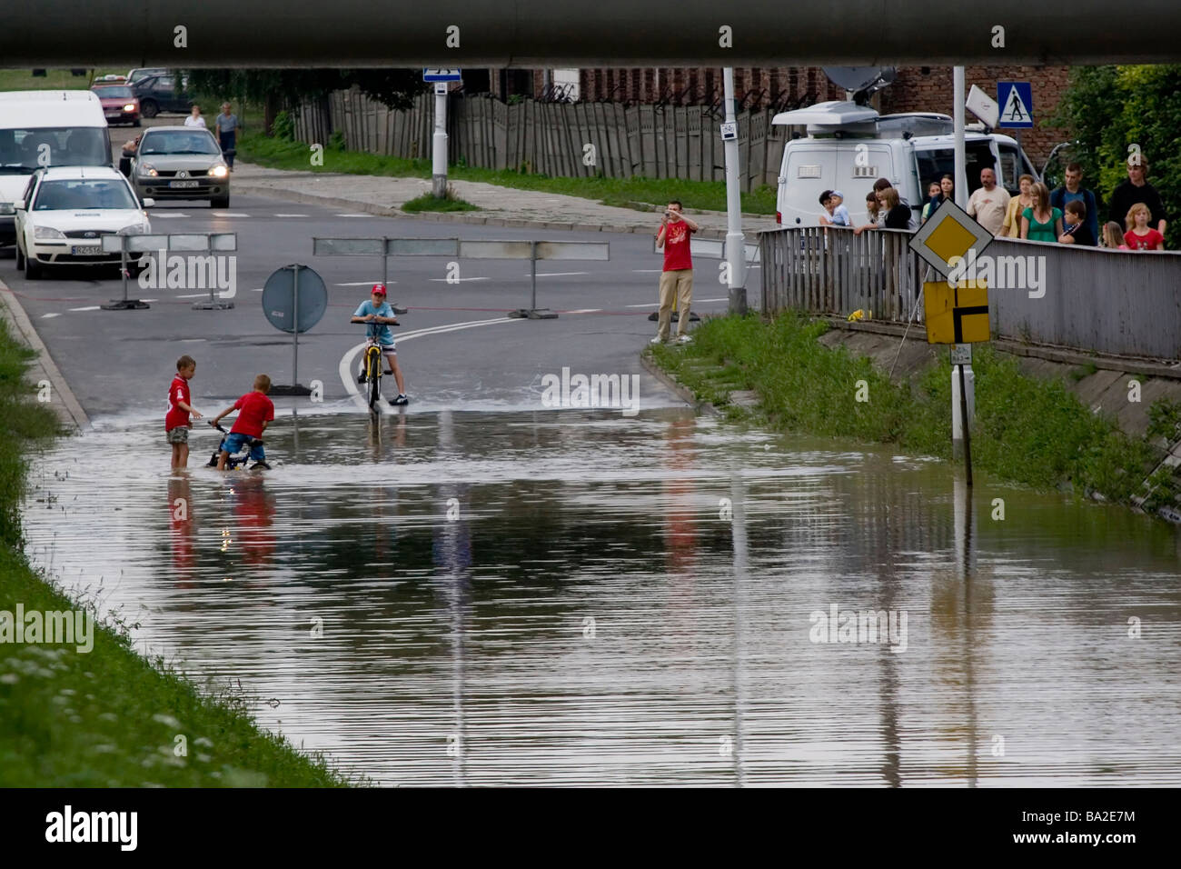 Children playing in flood water hi-res stock photography and images - Alamy