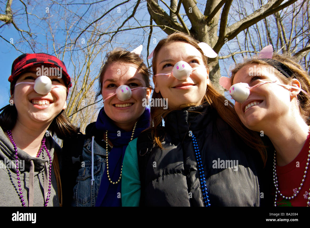Protesters wearing pig masks attending the Save the Farm protest march ...
