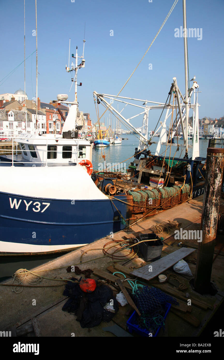 Fishing boat at the quayside in Weymouth Harbour, the popular seaside ...