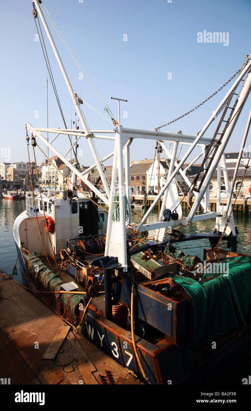 Fishing boat at the quayside in Weymouth Harbour, the popular seaside ...