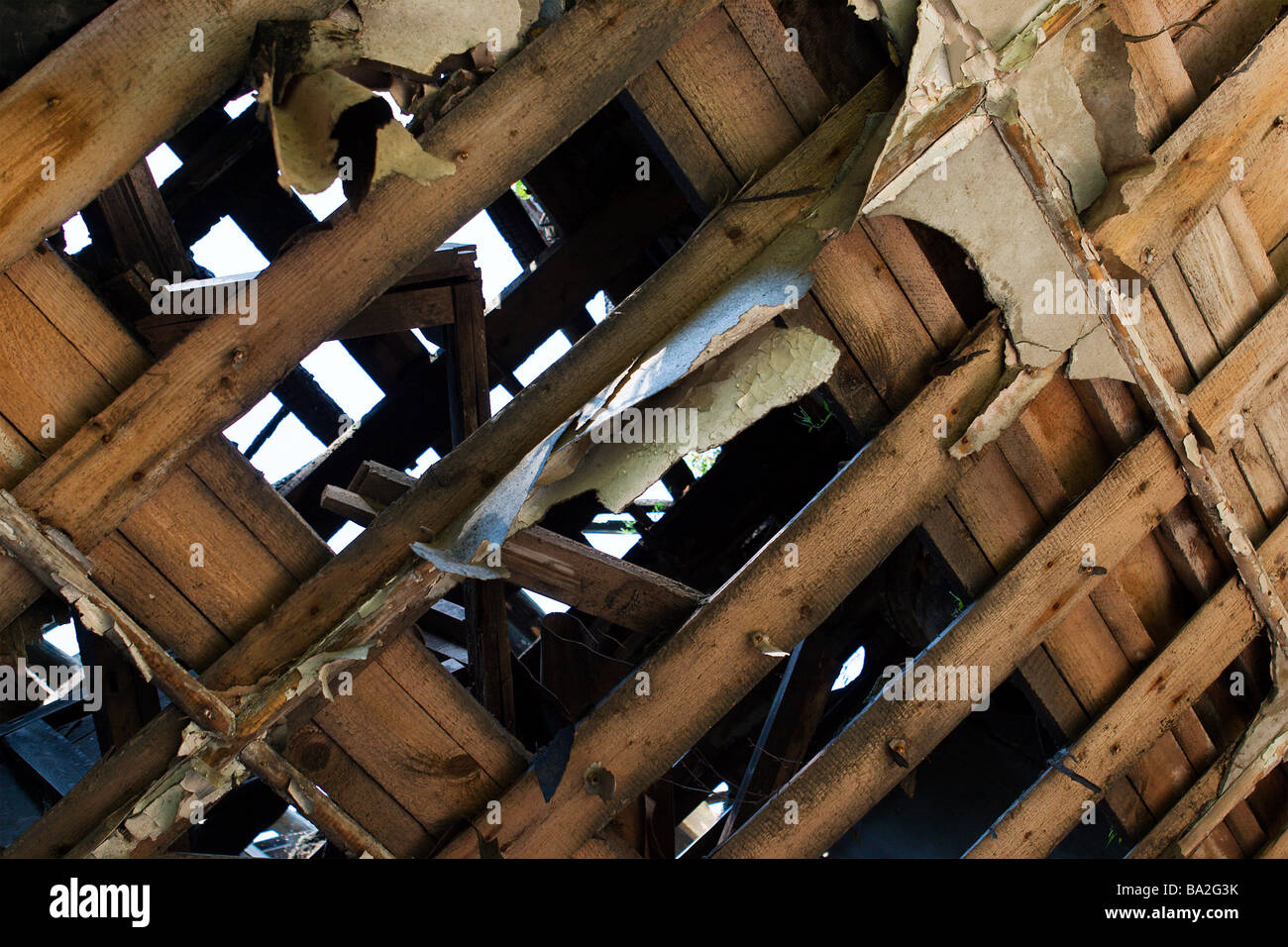 Breach in roof of wooden house Stock Photo - Alamy