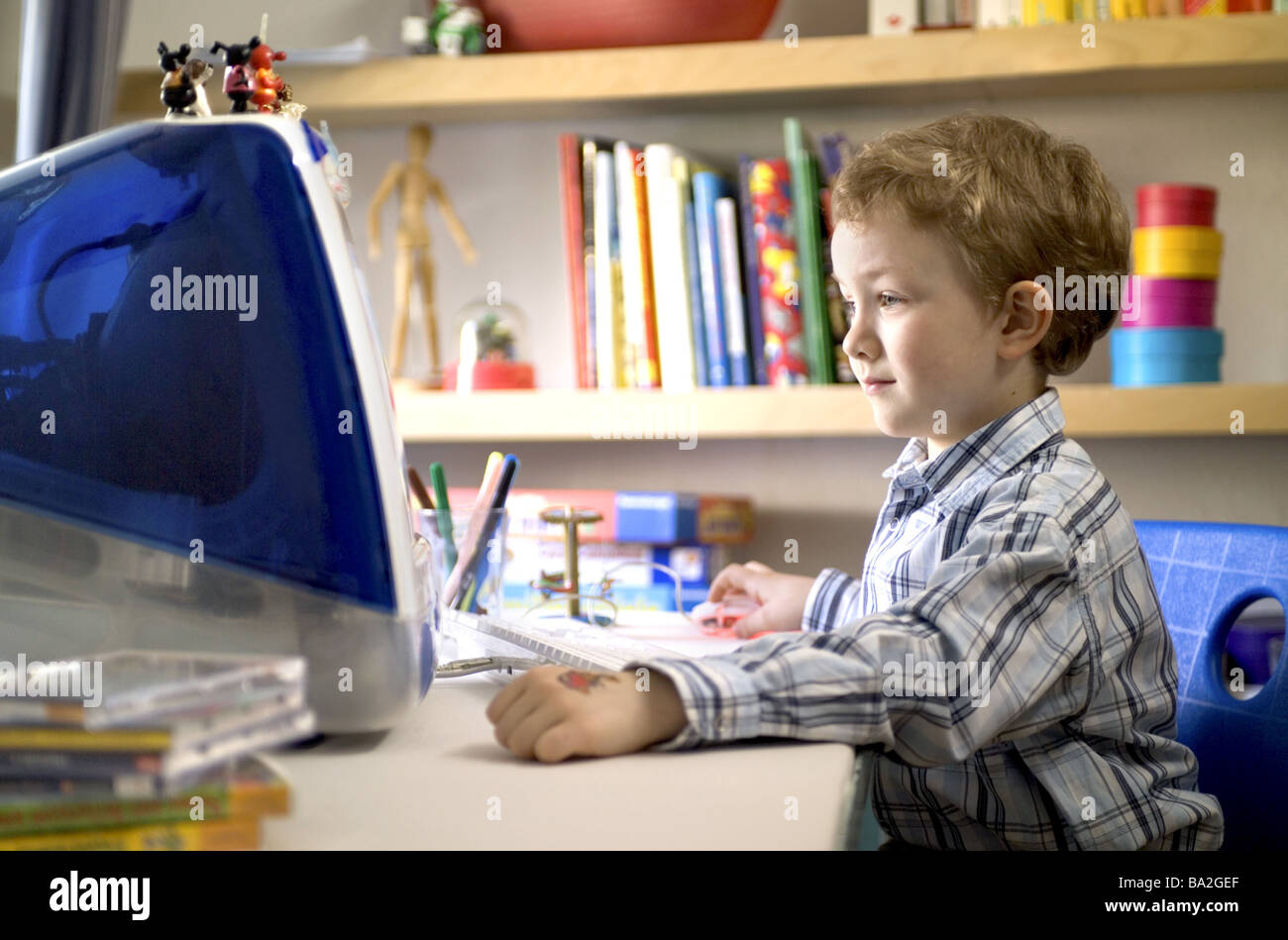 Give birth computers gaze screen semi-portrait at the side series child ...