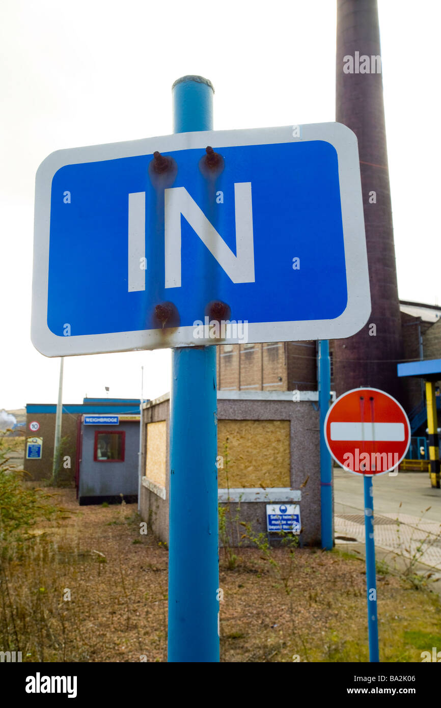 photograph of aging signage outside abandoned papermill Stock Photo - Alamy