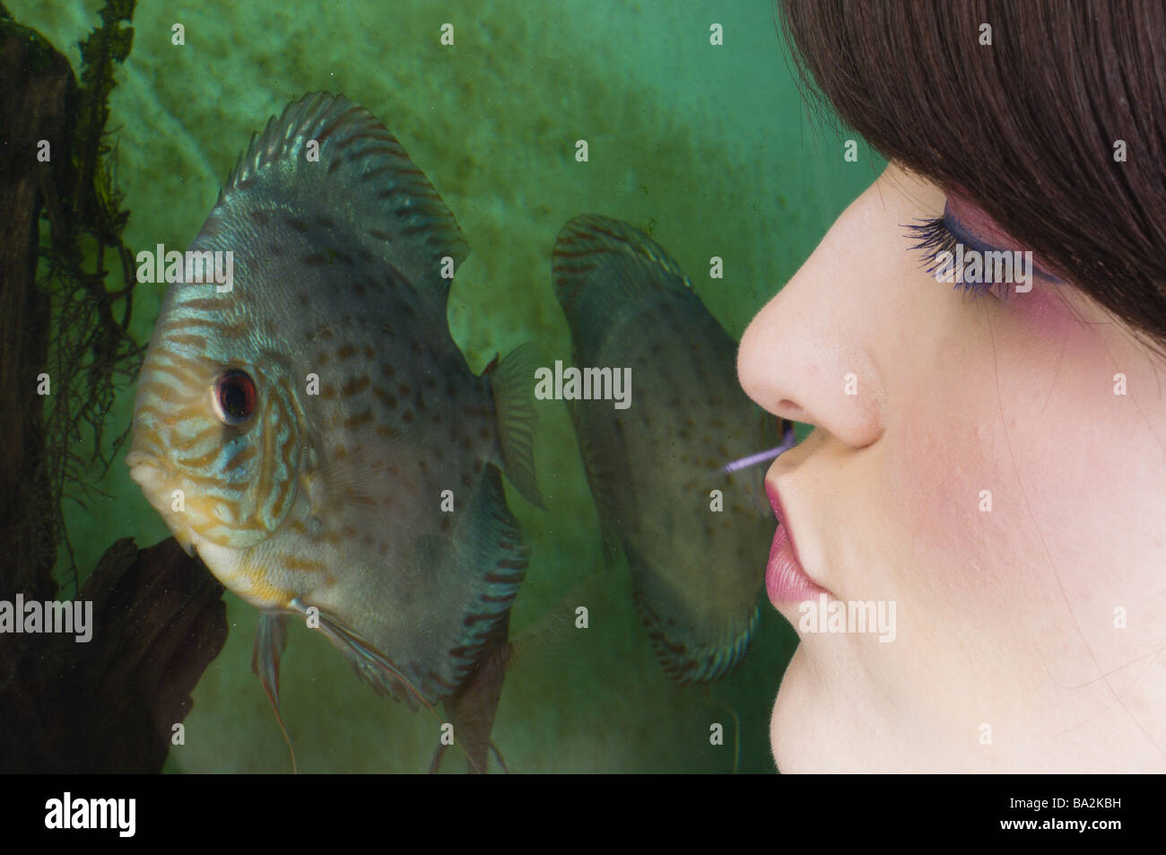 Woman young at the side profile broached facial expression kiss ...