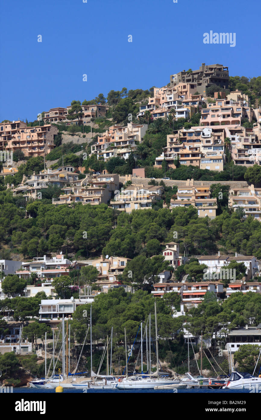 A portrait oriented view of villas on a hillside in Mallorca or Majorca ...