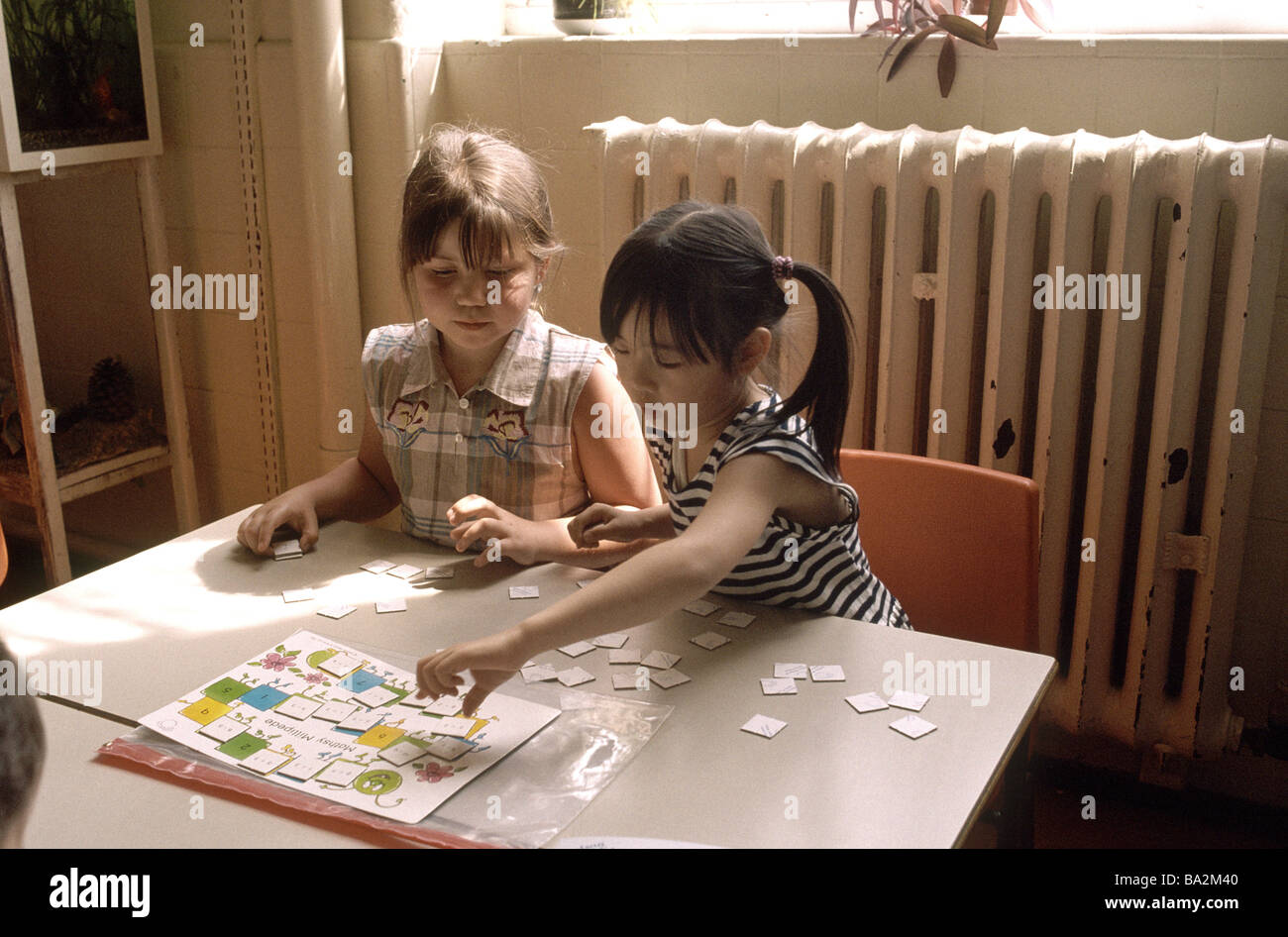 Girls playing a board game hi-res stock photography and images - Alamy
