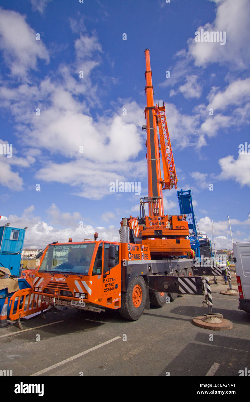 Large crane working dismantling another crane in Plymouth, Devon, UK ...
