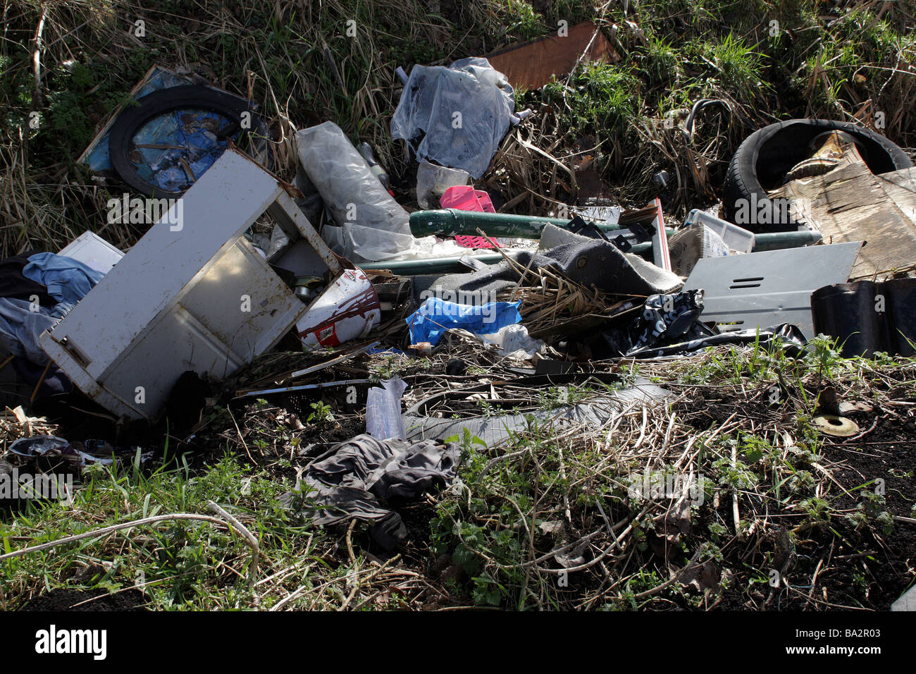 rubbish dumped in ditch Stock Photo - Alamy