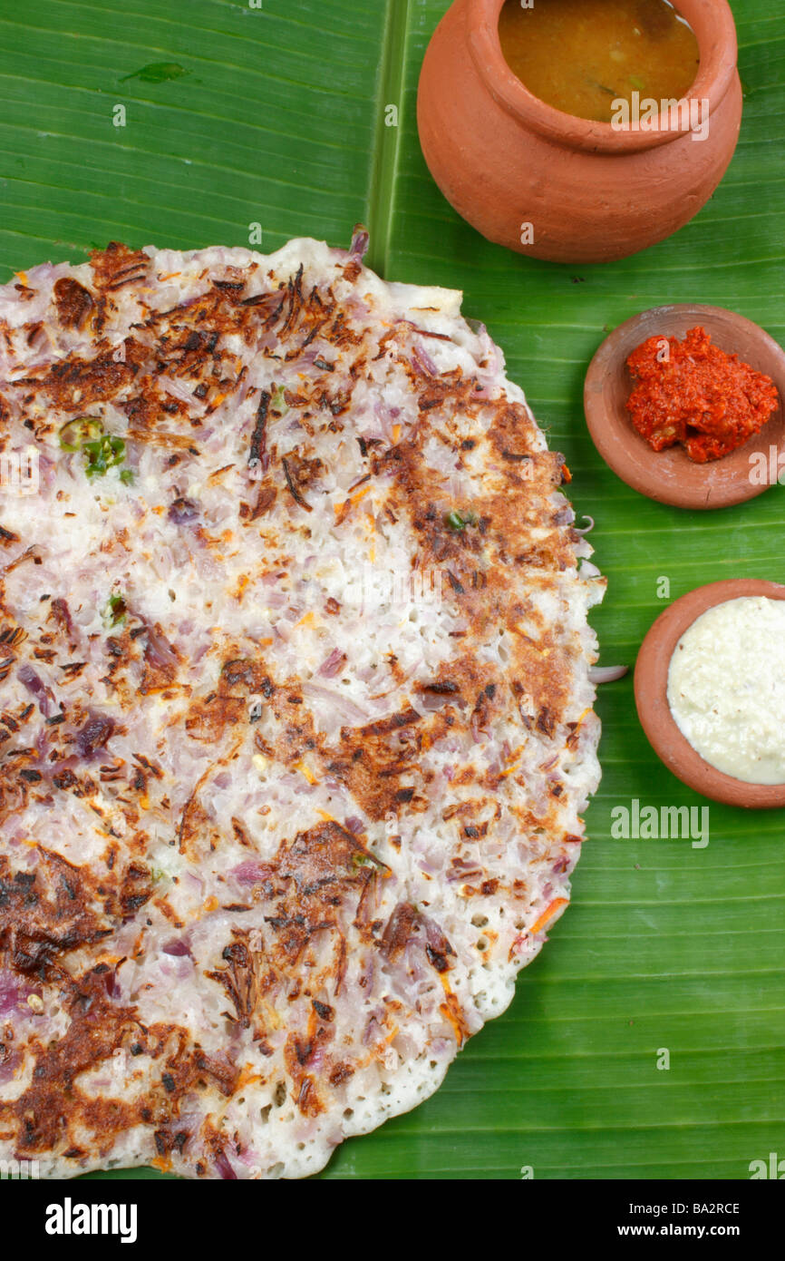 Onion Dosa is a typical South Indian Pancake and served with chutney ...