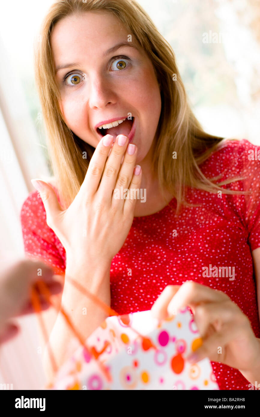 Woman receiving present Stock Photo - Alamy