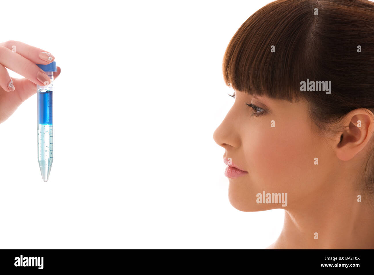 beautiful female lab worker holding up test tube Stock Photo - Alamy