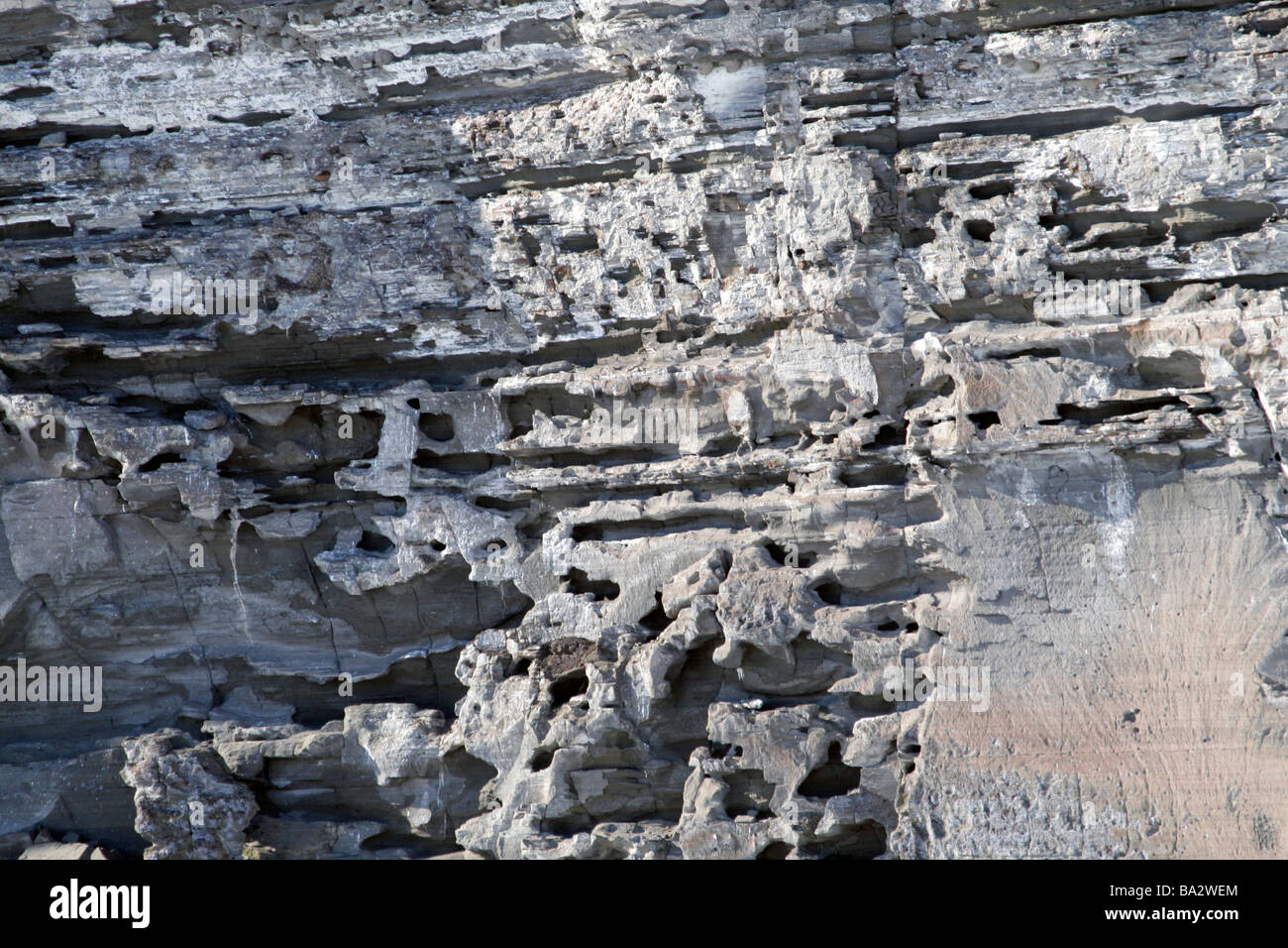 Eroded layers on a rock cliff Stock Photo - Alamy