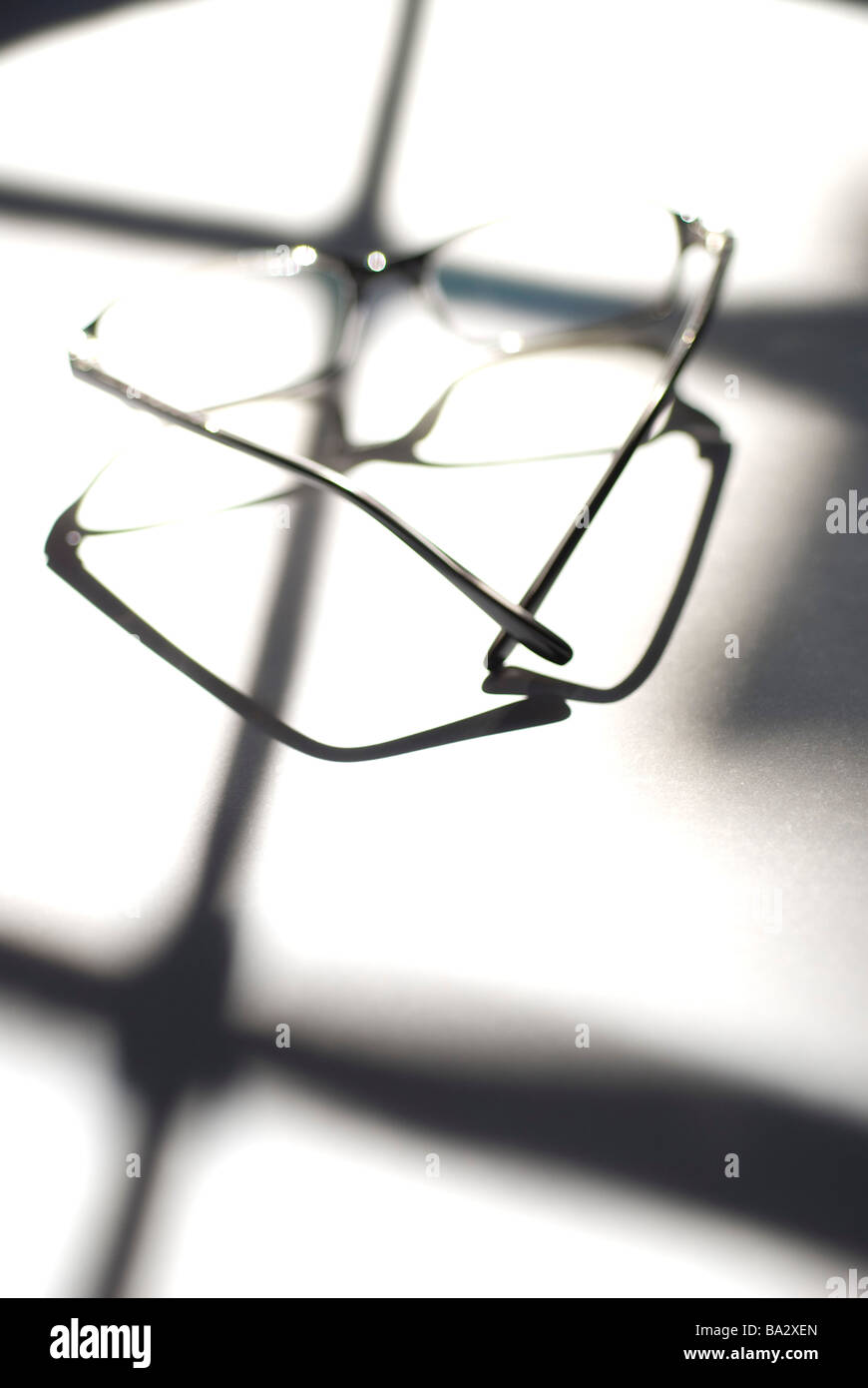 lens reading glasses under a window light reflexion Stock Photo - Alamy