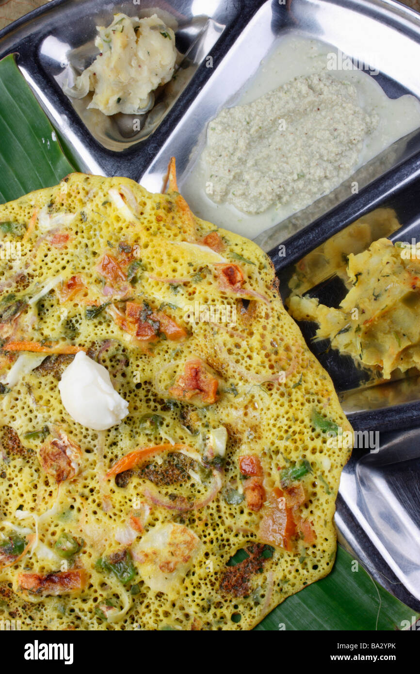 Tomato Dosa is a spicy pancake from South Indian Cuisine Stock Photo ...