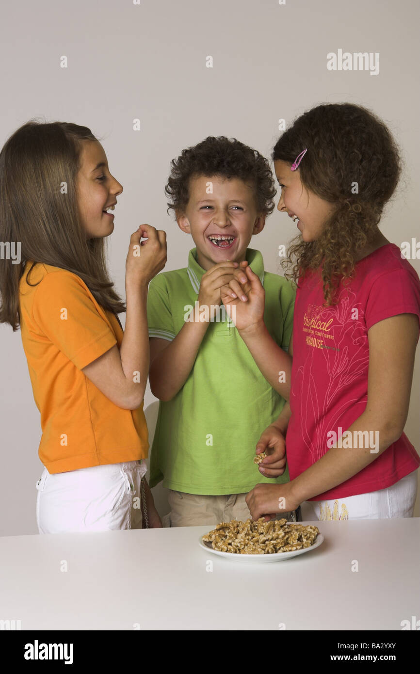 Give birth girls laughs walnut-halves eats stands series people ...