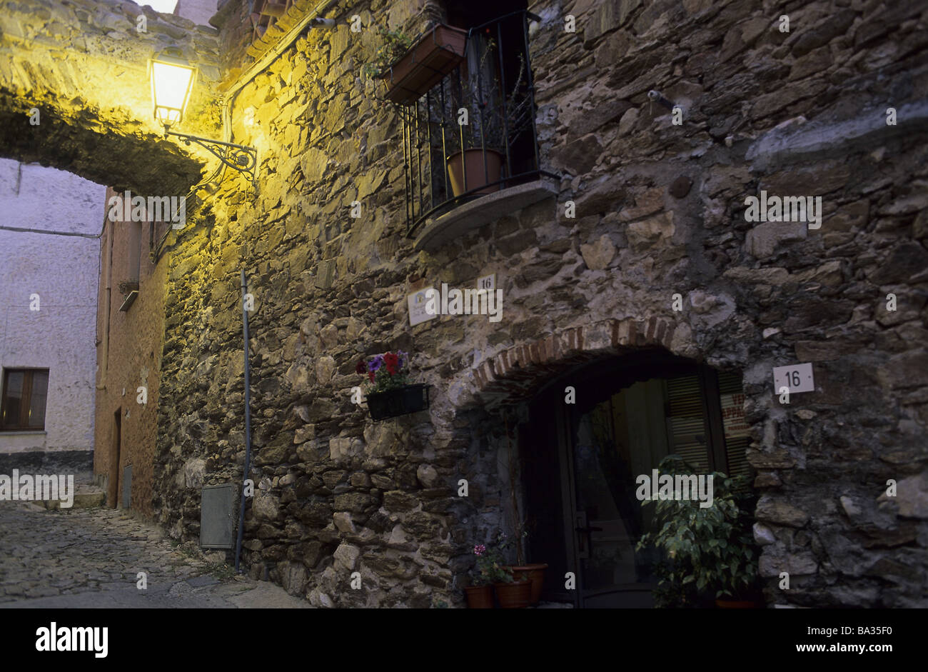 Italy Sardinia Posada house-facade detail streetlight twilight ...