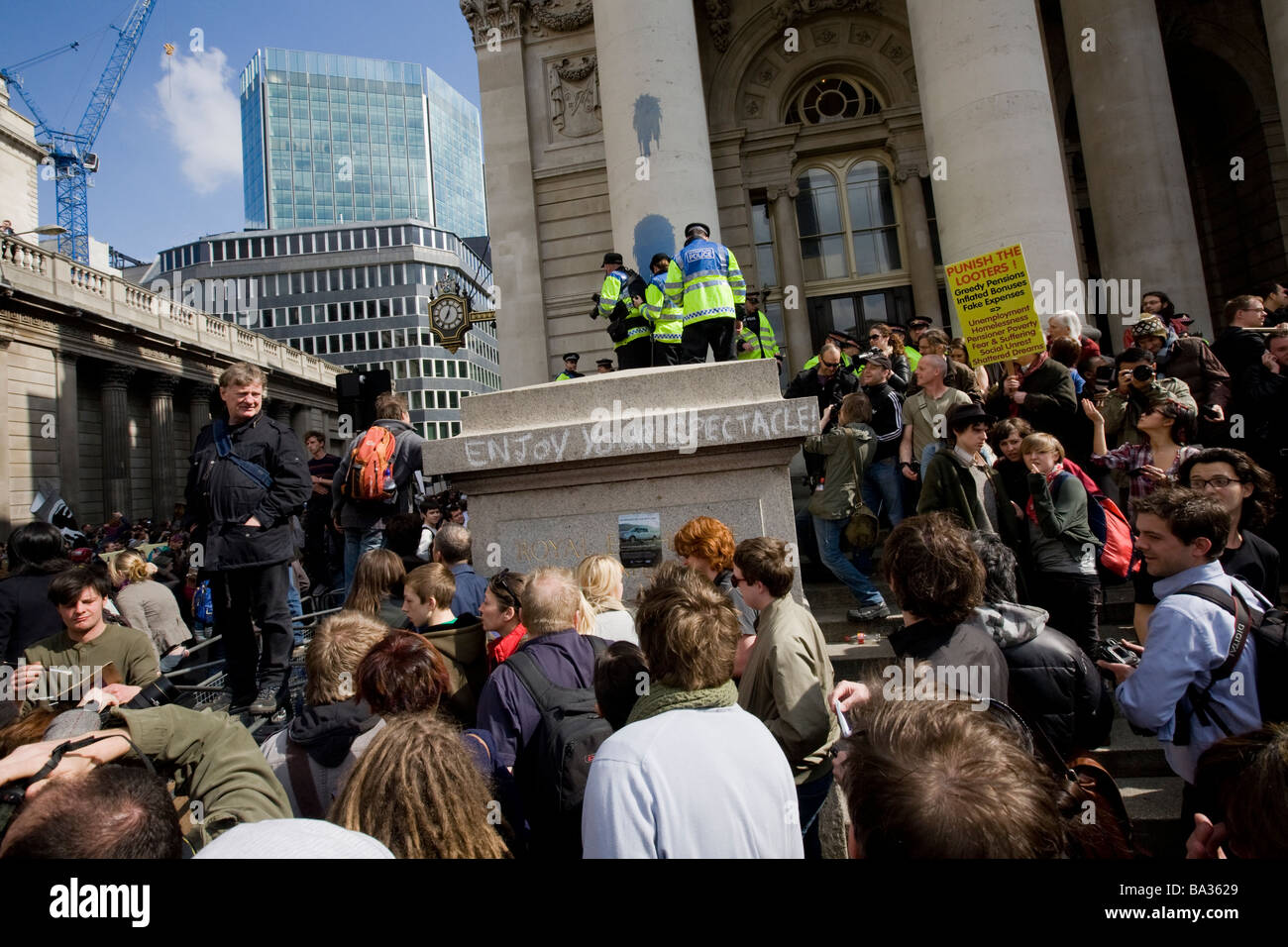 Police watch crowds from above at the G20 protest at Bank of England ...