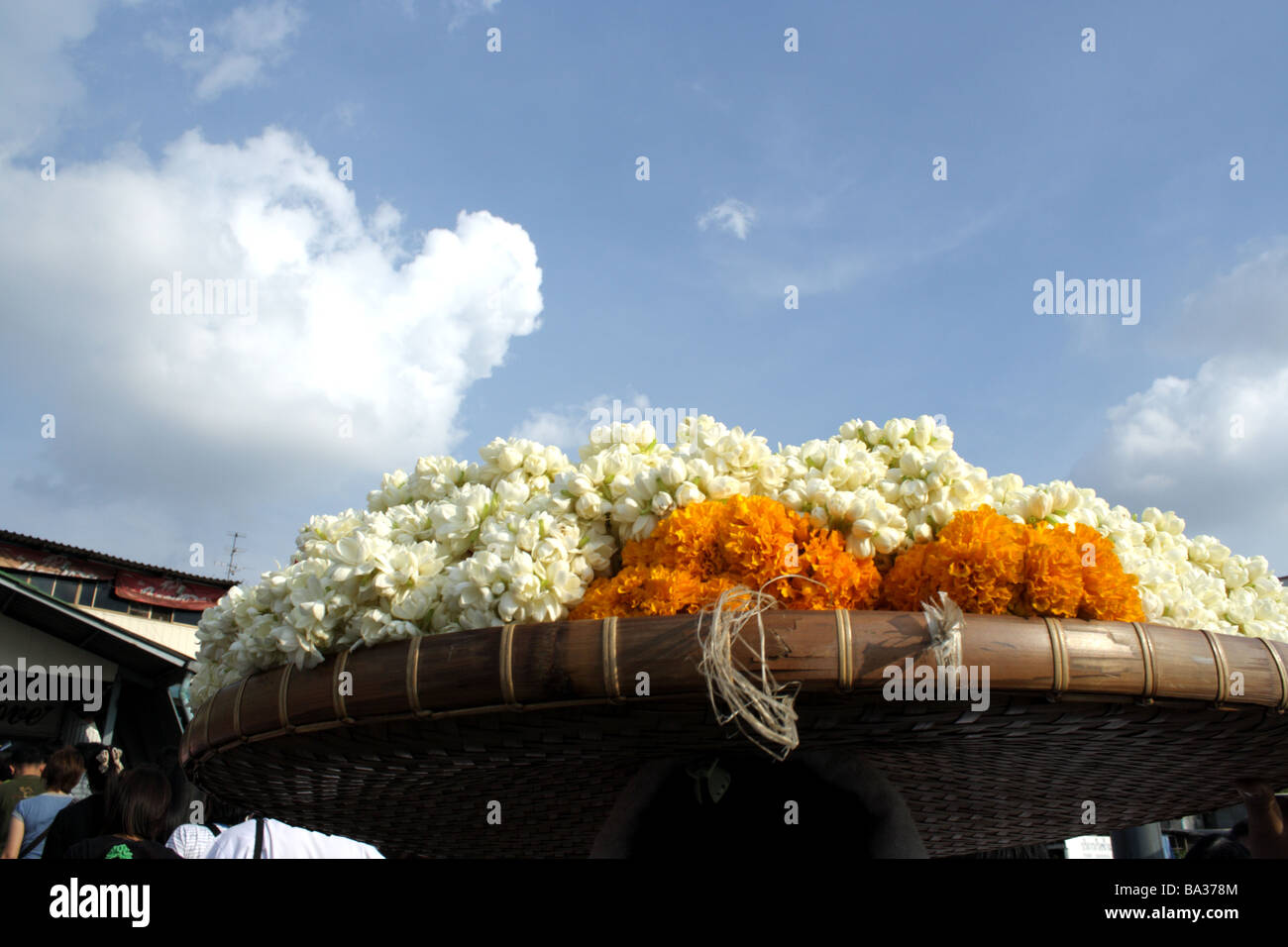 Thai merchant with garland flowers Stock Photo - Alamy