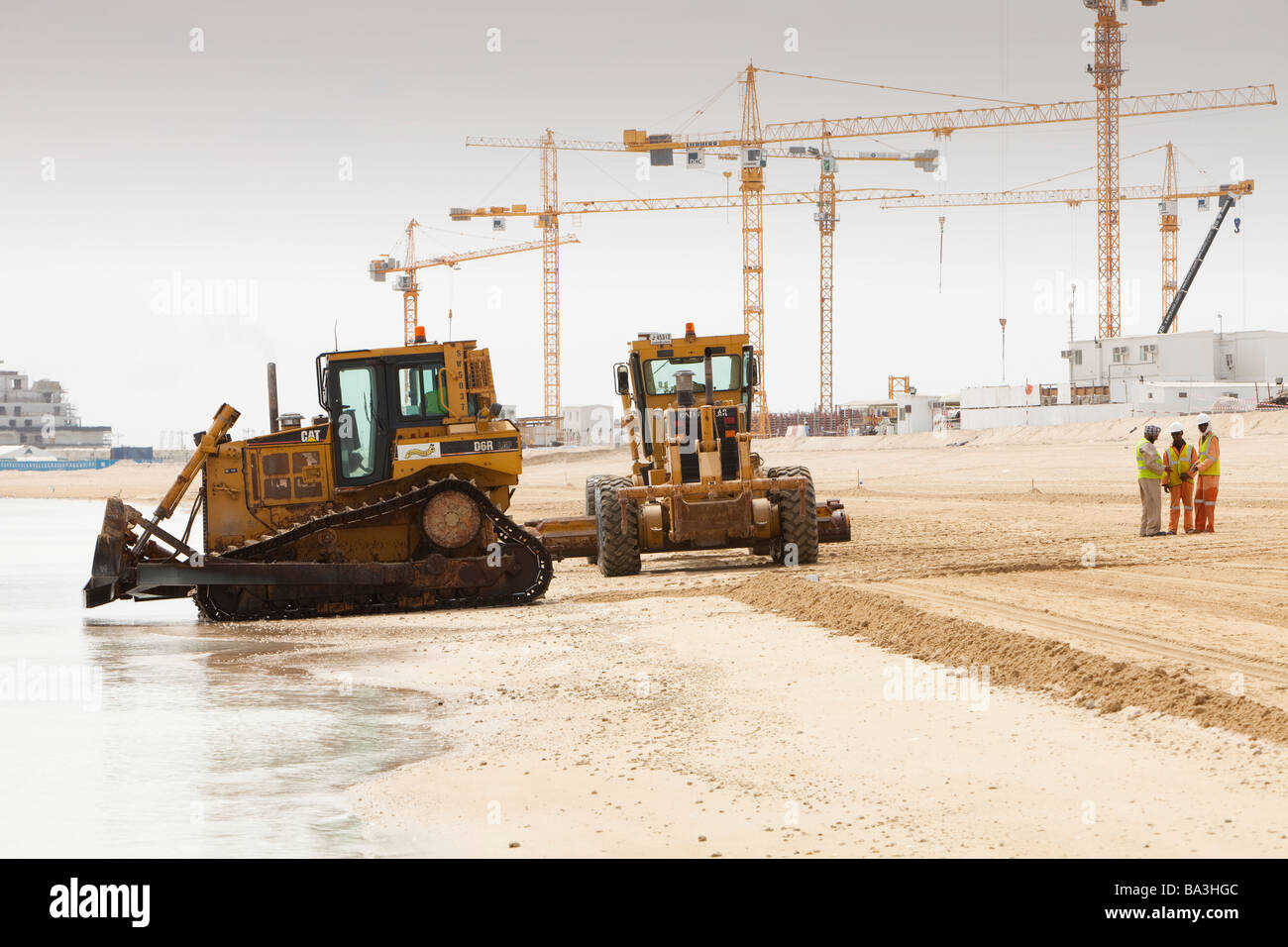 Constructing a new beach reclaimed from the sea on the Palm in Dubai ...