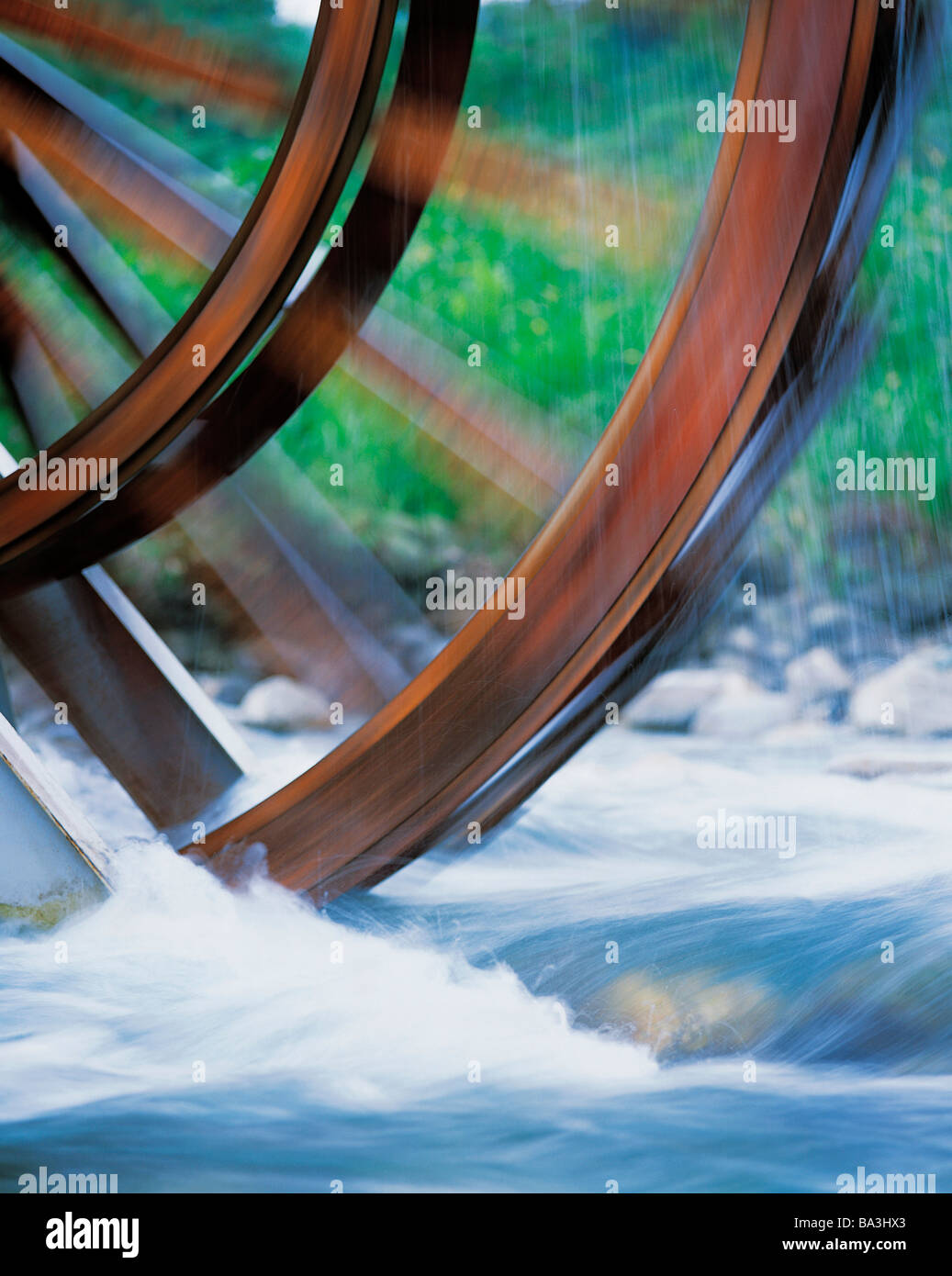 Blurred view of water falling off a waterwheel close up Stock Photo - Alamy