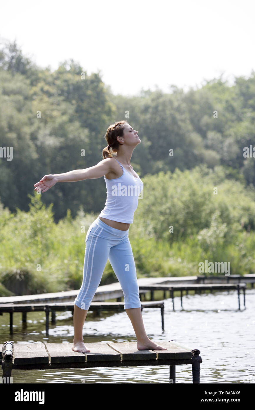 Woman young at the side bridge movement meditation-practice series ...