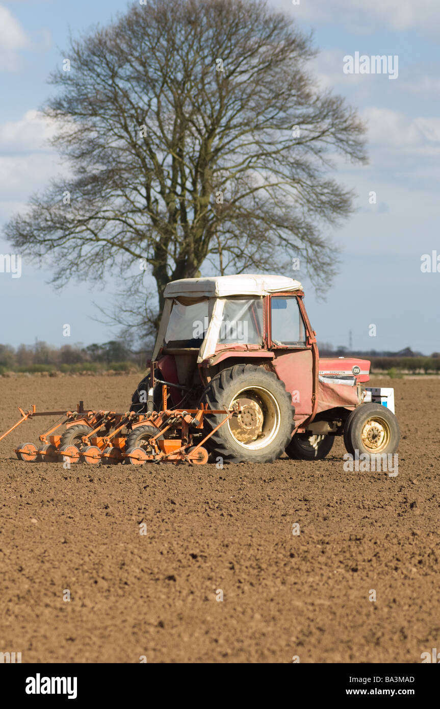 Tractor sowing seeds seed drill hi-res stock photography and images - Alamy