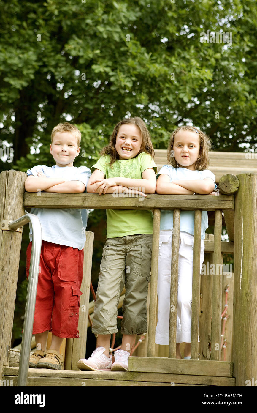 Girls boy hand-rails leans playground series people children three 6-7 ...