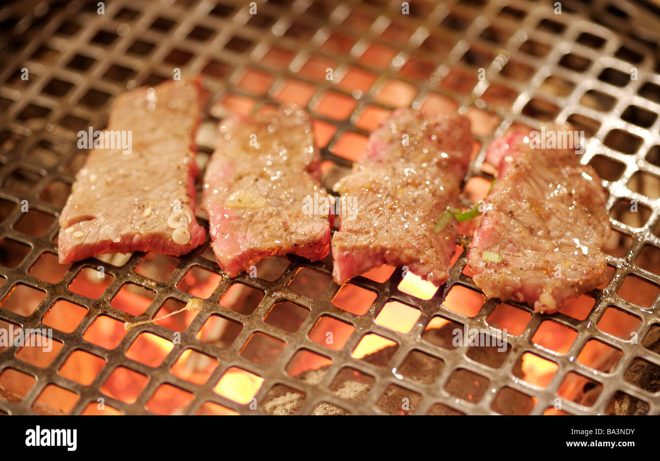 Meat over charcoal fire Stock Photo - Alamy